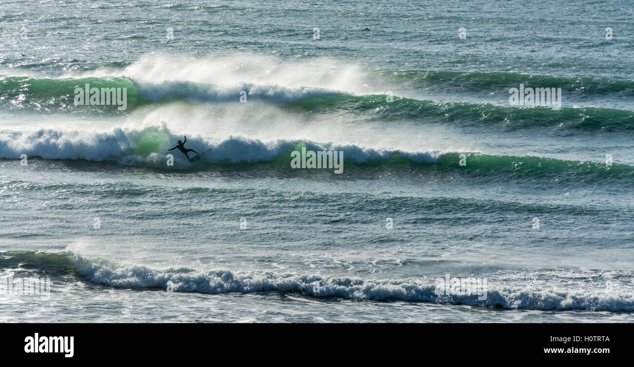 Blown back waves at Polzeath in North Cornwall Stock Photo - Alamy