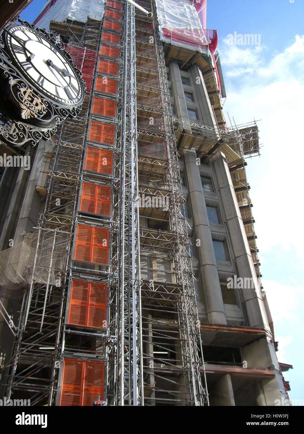 Clock, Scaffold, Orange, Throgmorton Street, London Stock Photo - Alamy