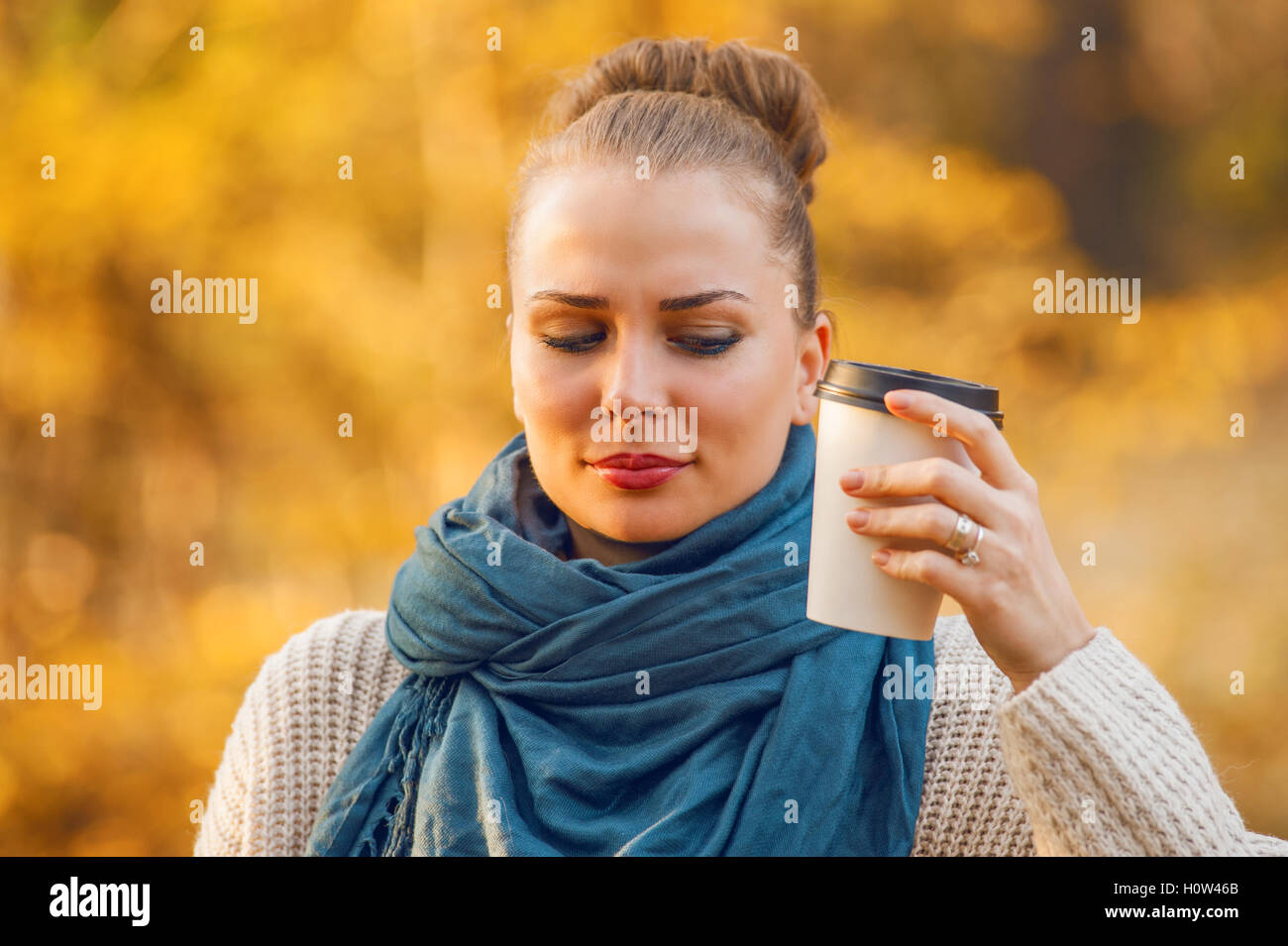 Portrait of pretty female holding almost empty cup of coffee Stock ...