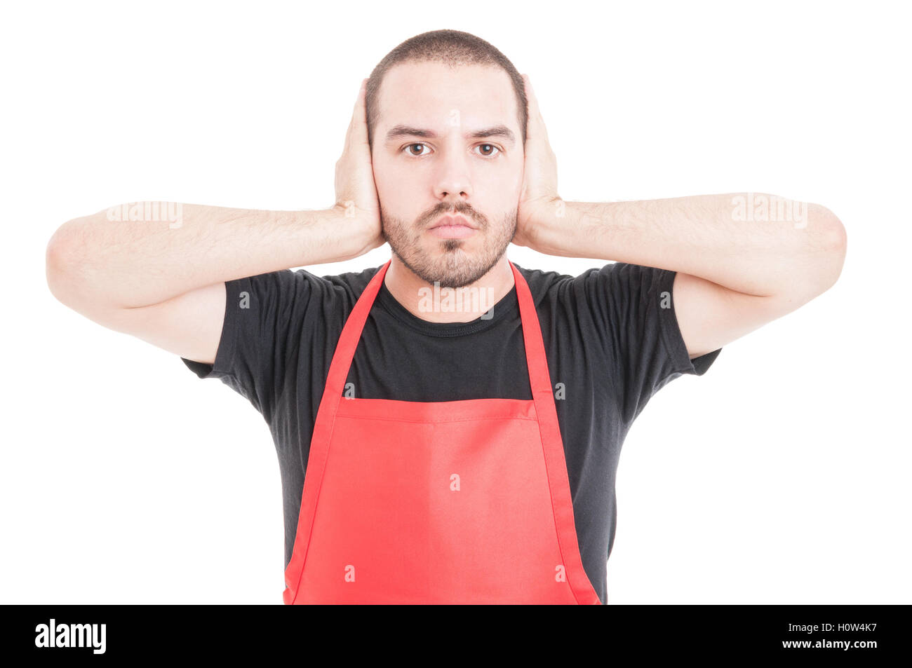 Young employee covering his ears refusing to listen or hear no evil ...