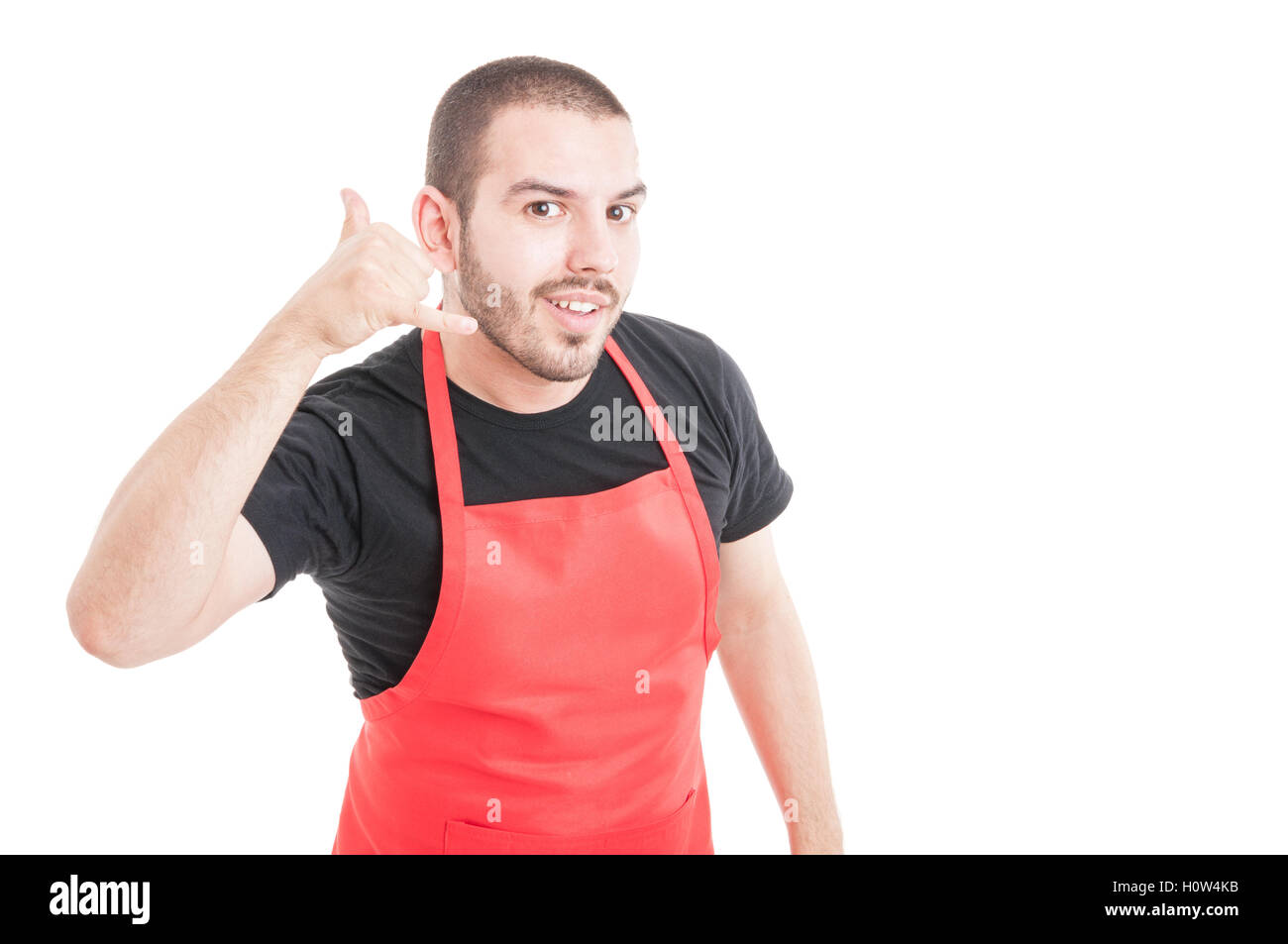 Cheerful butcher doing call gesture with hand isolated on white ...