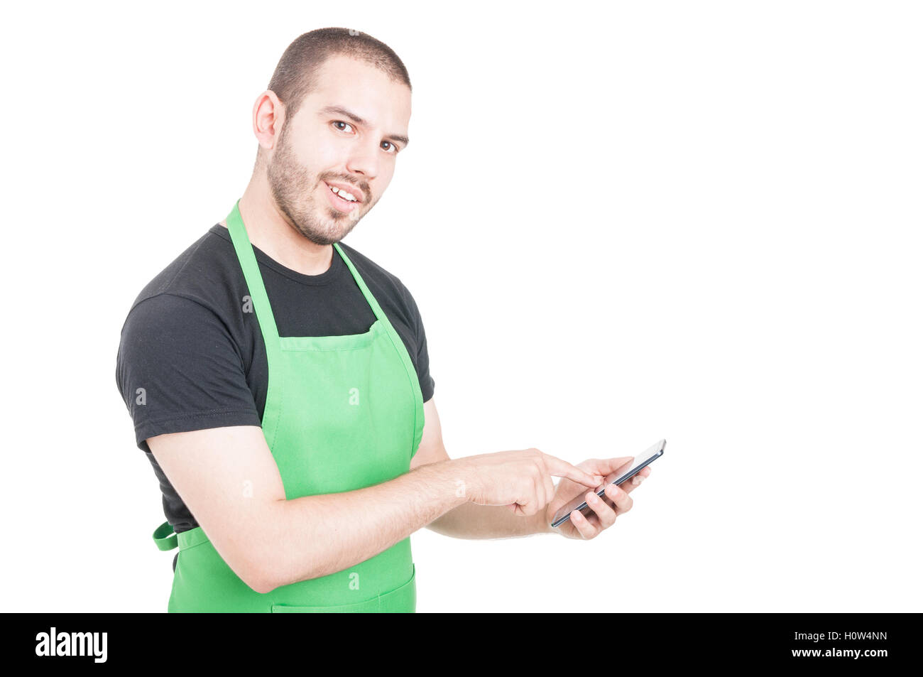 Young employee texting on phone and smiling isolated on white ...