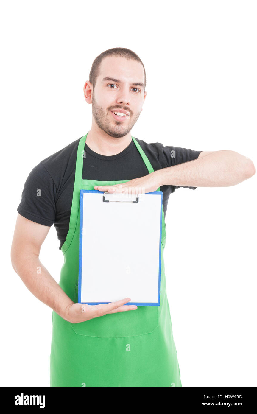 Handsome supermarket employee holding and showing clipboard isolated on ...