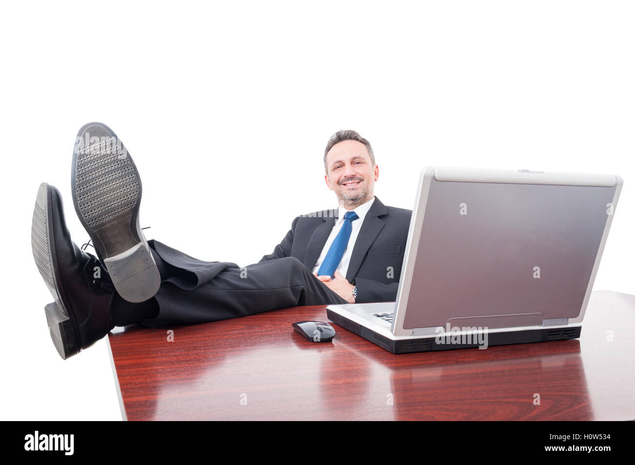 Relaxed manager smiling and taking a break of his work isolated on ...