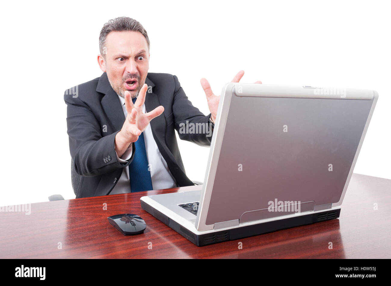 Terrified manager seeing something bad on laptop and screaming isolated ...