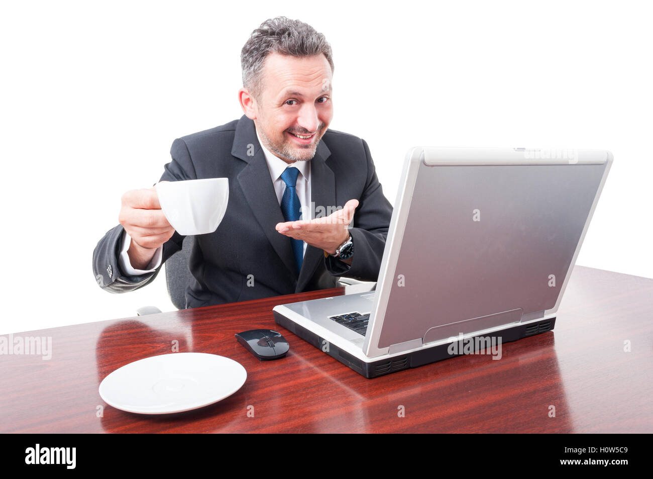 Cheerful director at his desk inviting you to drink coffee isolated on ...