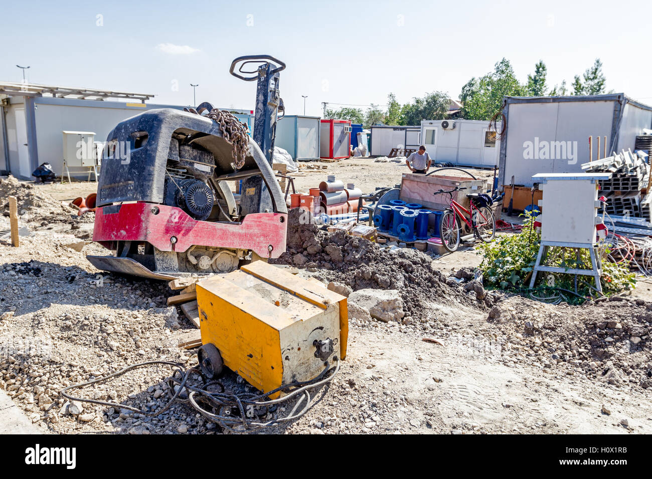 View on construction site with machinery, people at work. Landscape ...