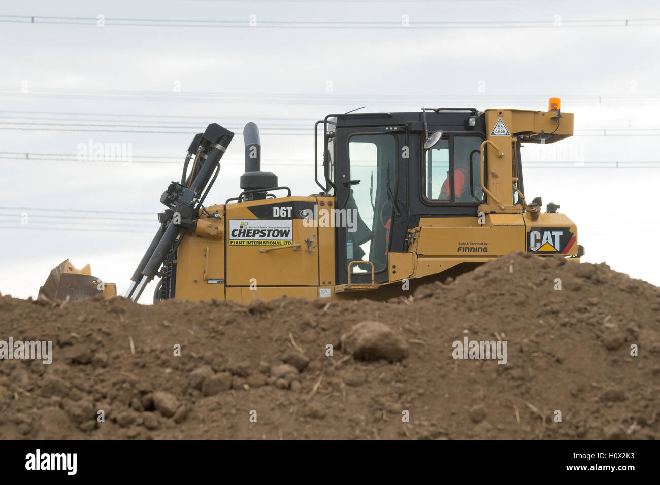 Kingsnorth quarry, in hoo kent a bulldozer moving & flatting top soil ...