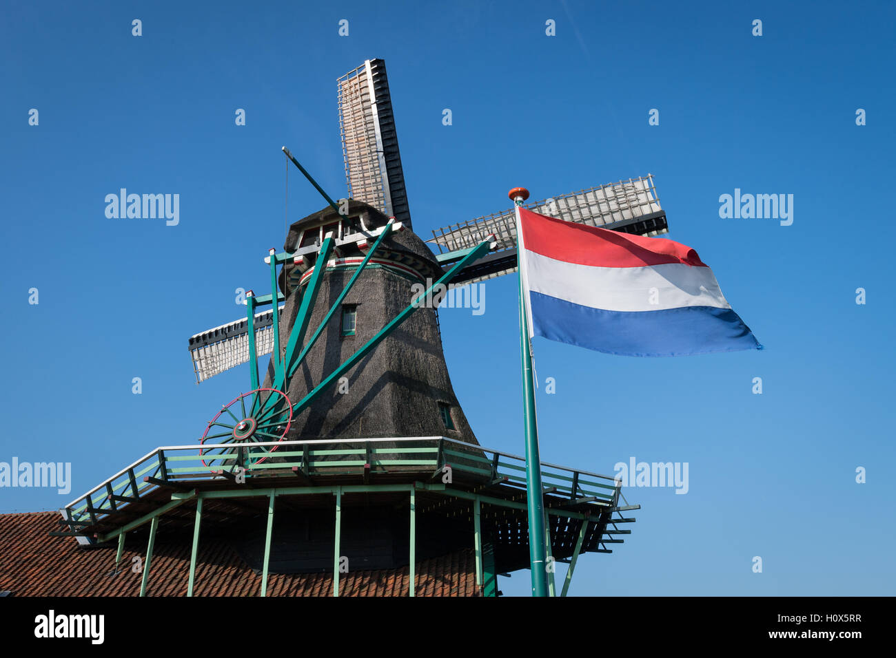 Netherlands flag and windmill at Zaanse Schans, Netherlands Stock Photo ...