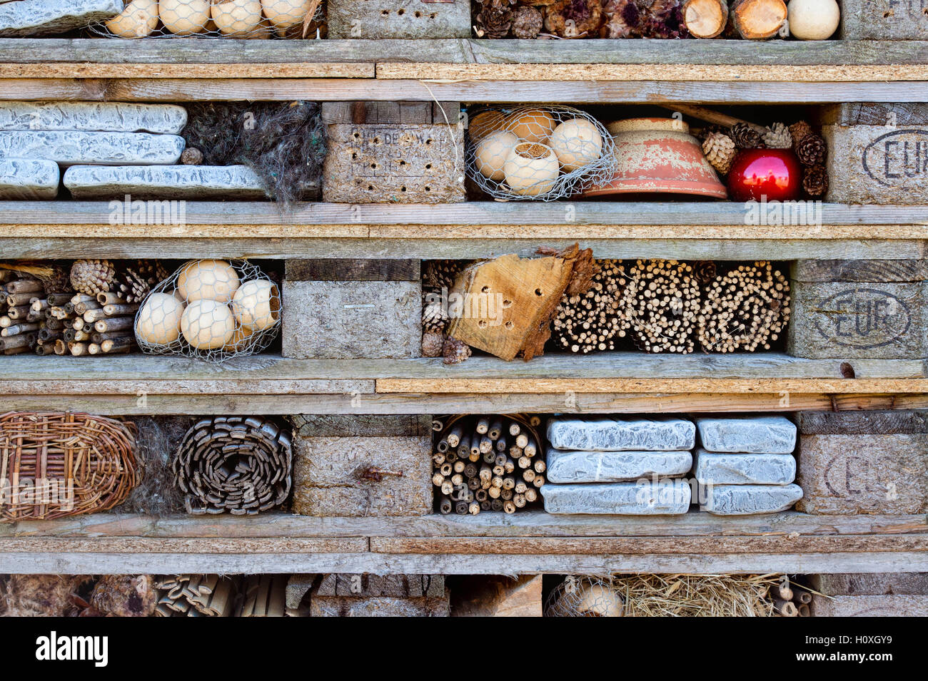 Insect home made using old wooden pallets for encouraging insects ...