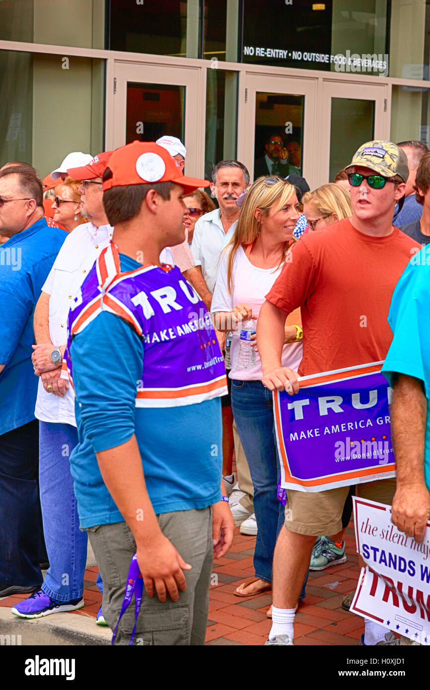 Young men wearing Trump supporter banners at the convention center in ...