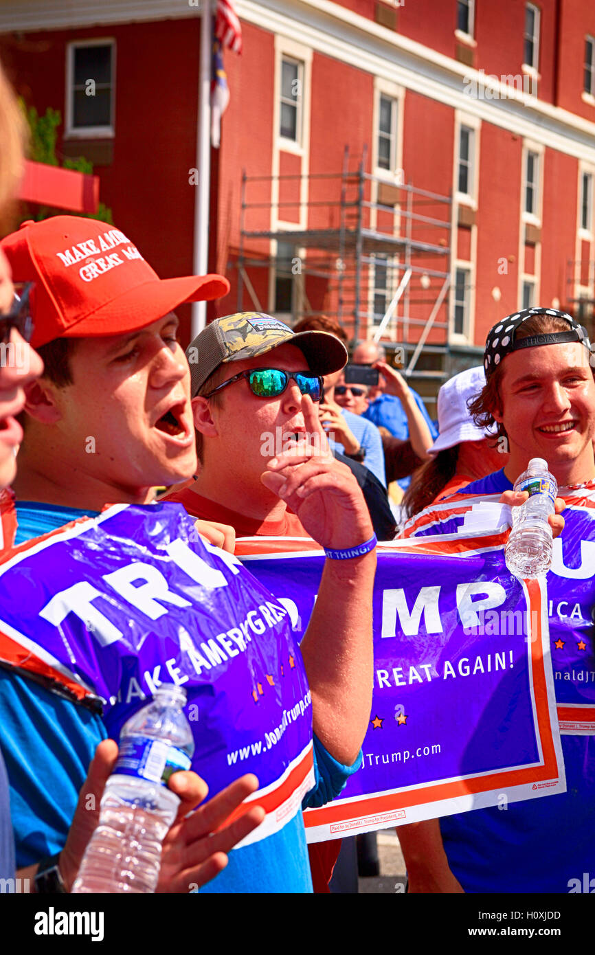 Young men wearing Trump supporter banners at the convention center in ...