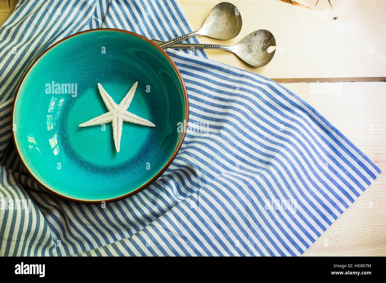 Rustic marine table setting with sea stars and vintage tablecloth Stock ...