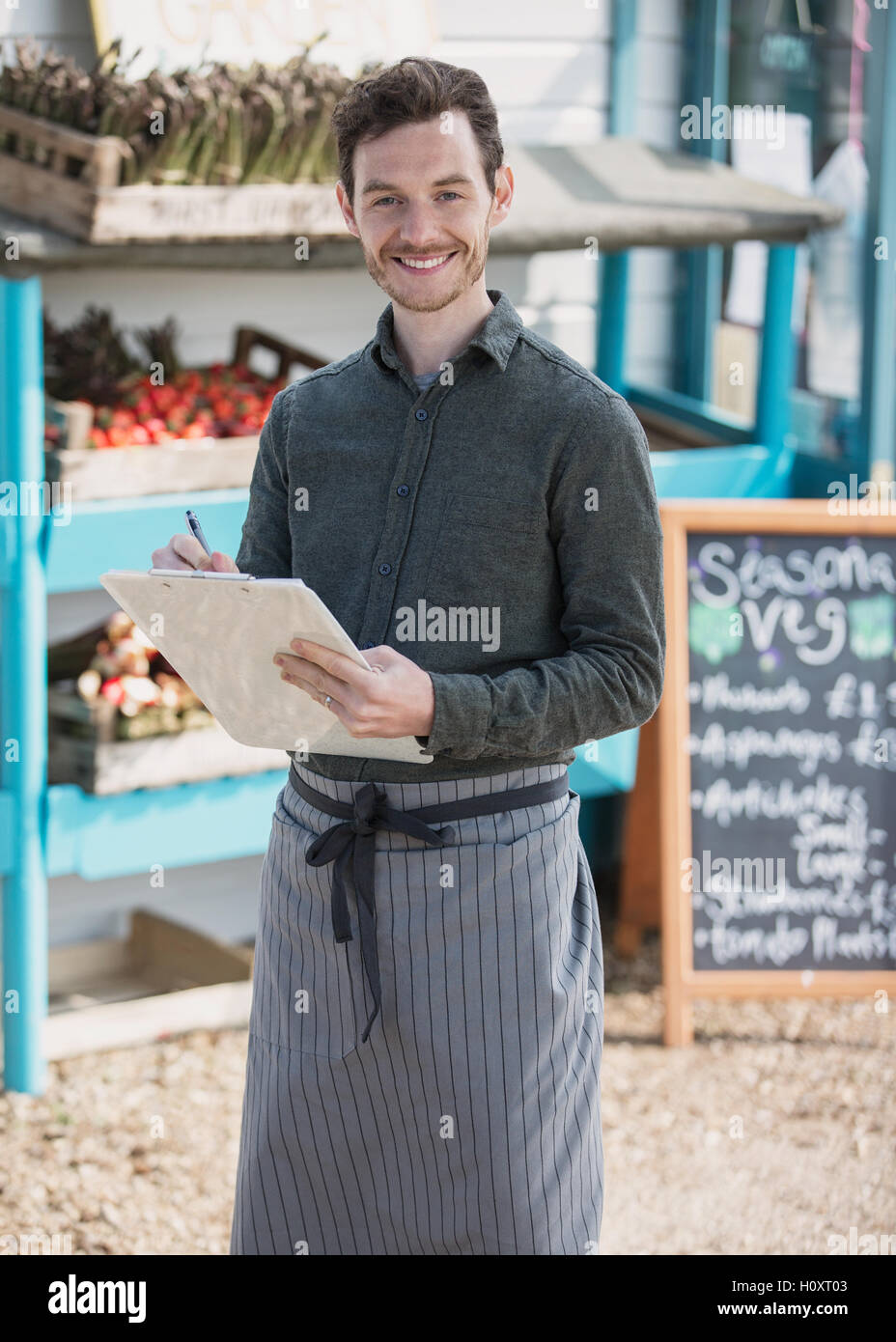 portrait smiling farmer's market worker Stock Photo - Alamy