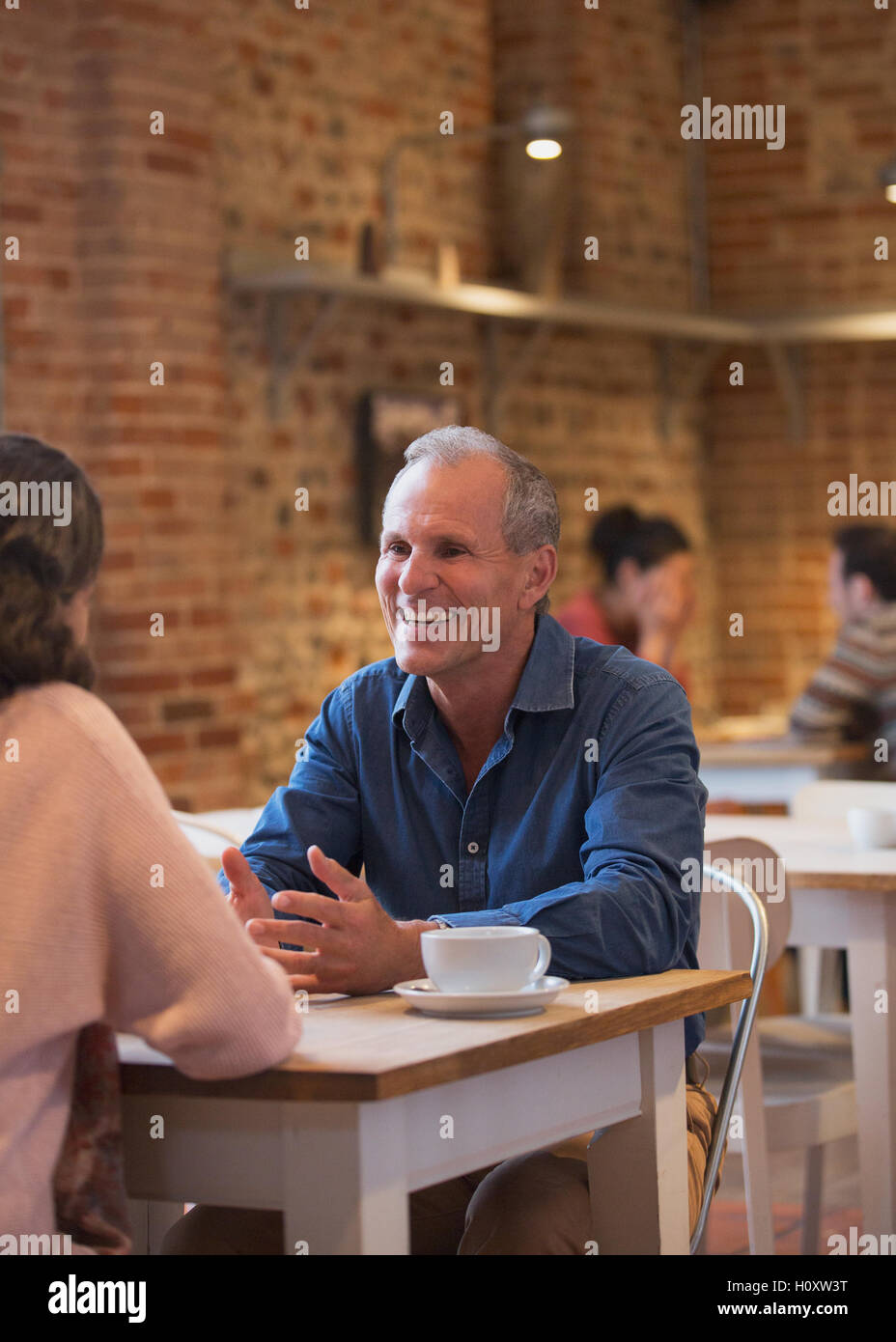 smiling couple talking cafe Stock Photo - Alamy