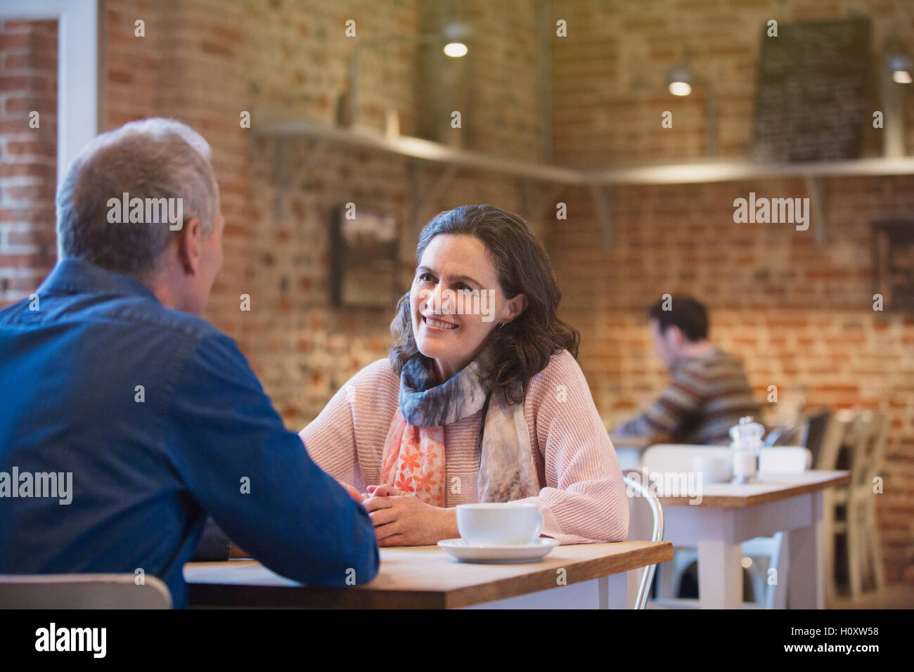 smiling couple talking cafe Stock Photo - Alamy