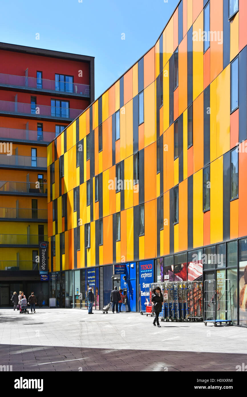 Tesco Express supermarket store on ground floor of colourful apartment ...