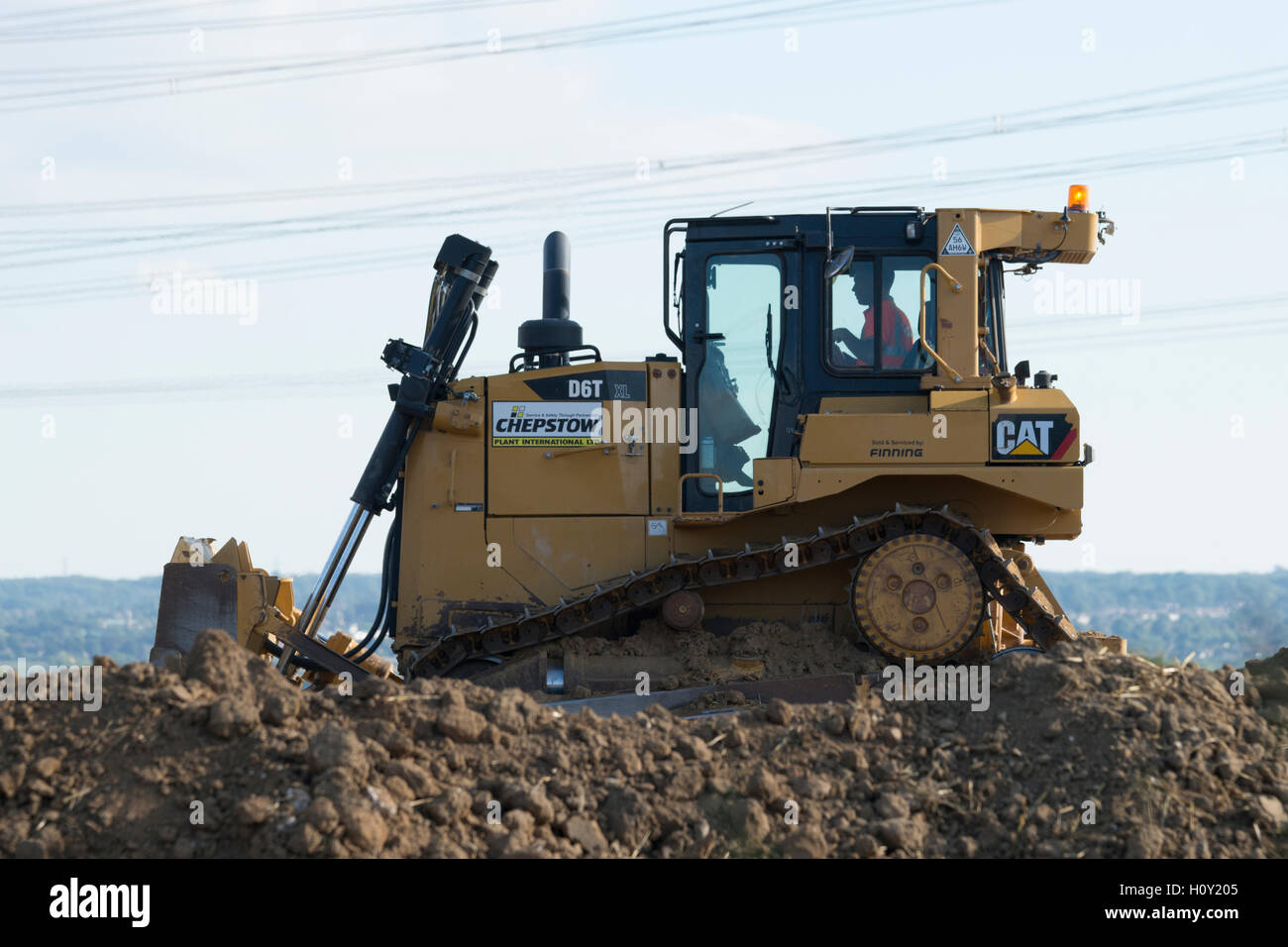 Kingsnorth quarry, in hoo kent a bulldozer moving & flatting top soil ...