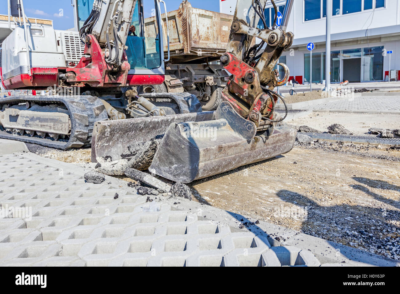 Tractor bucket breaking asphalt on hi-res stock photography and images ...