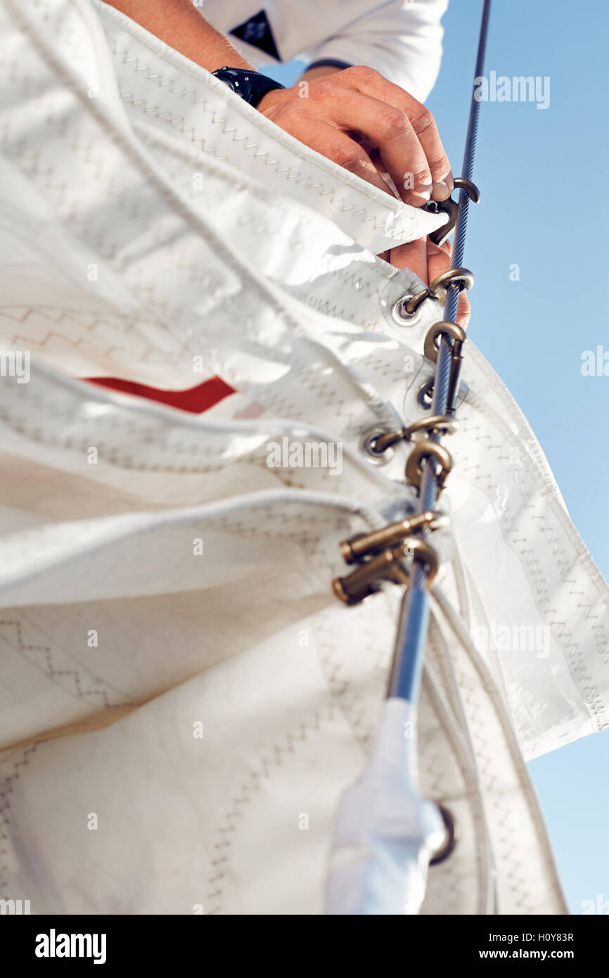 Preparing before lifting staysail sails Stock Photo - Alamy