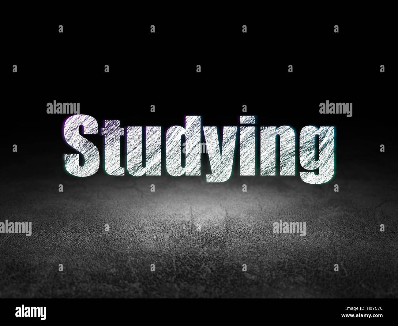 Studying concept: Studying in grunge dark room Stock Photo - Alamy