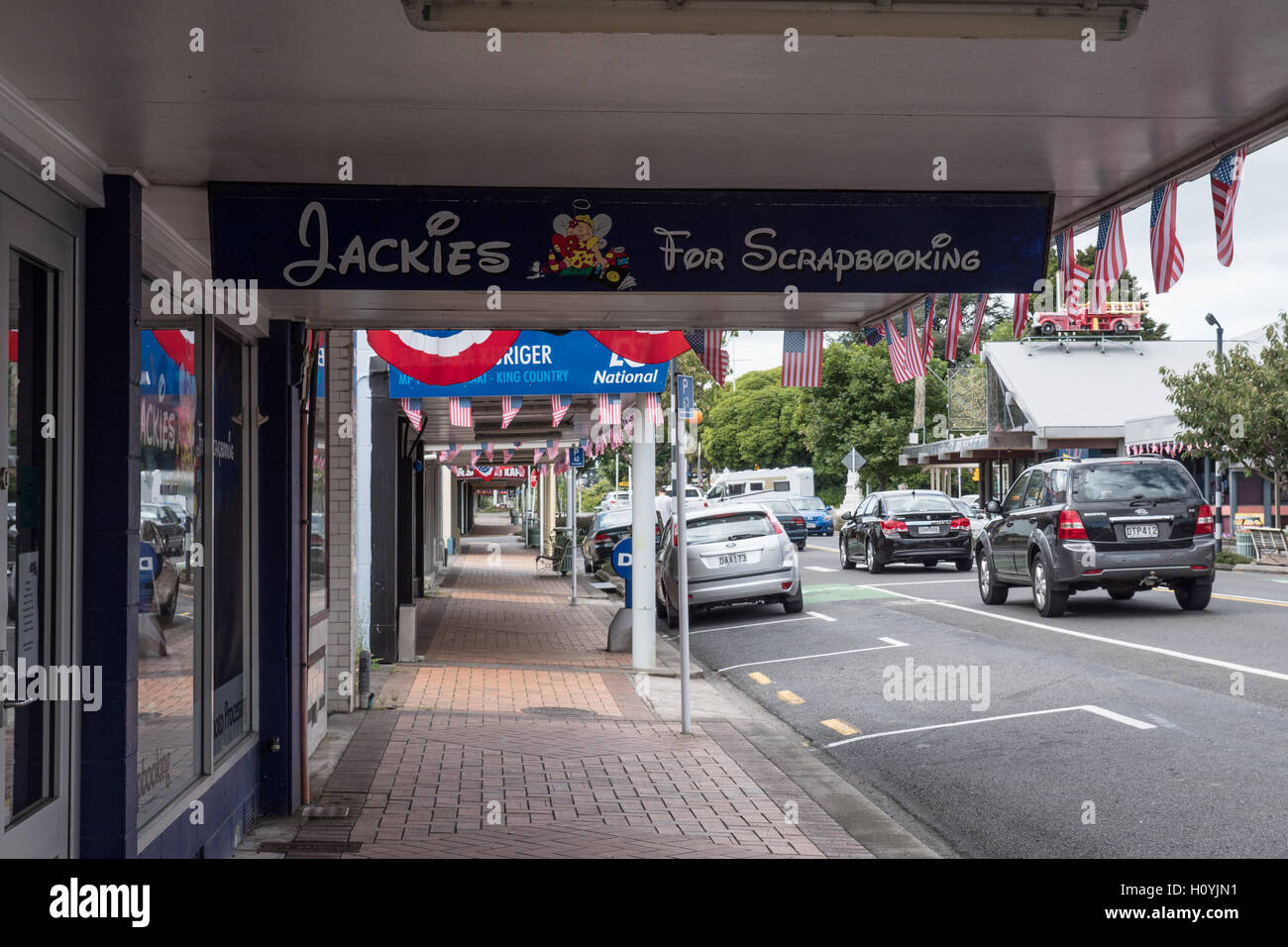 Shops and sidewalk on a main street in Inglewood, North Island, New ...