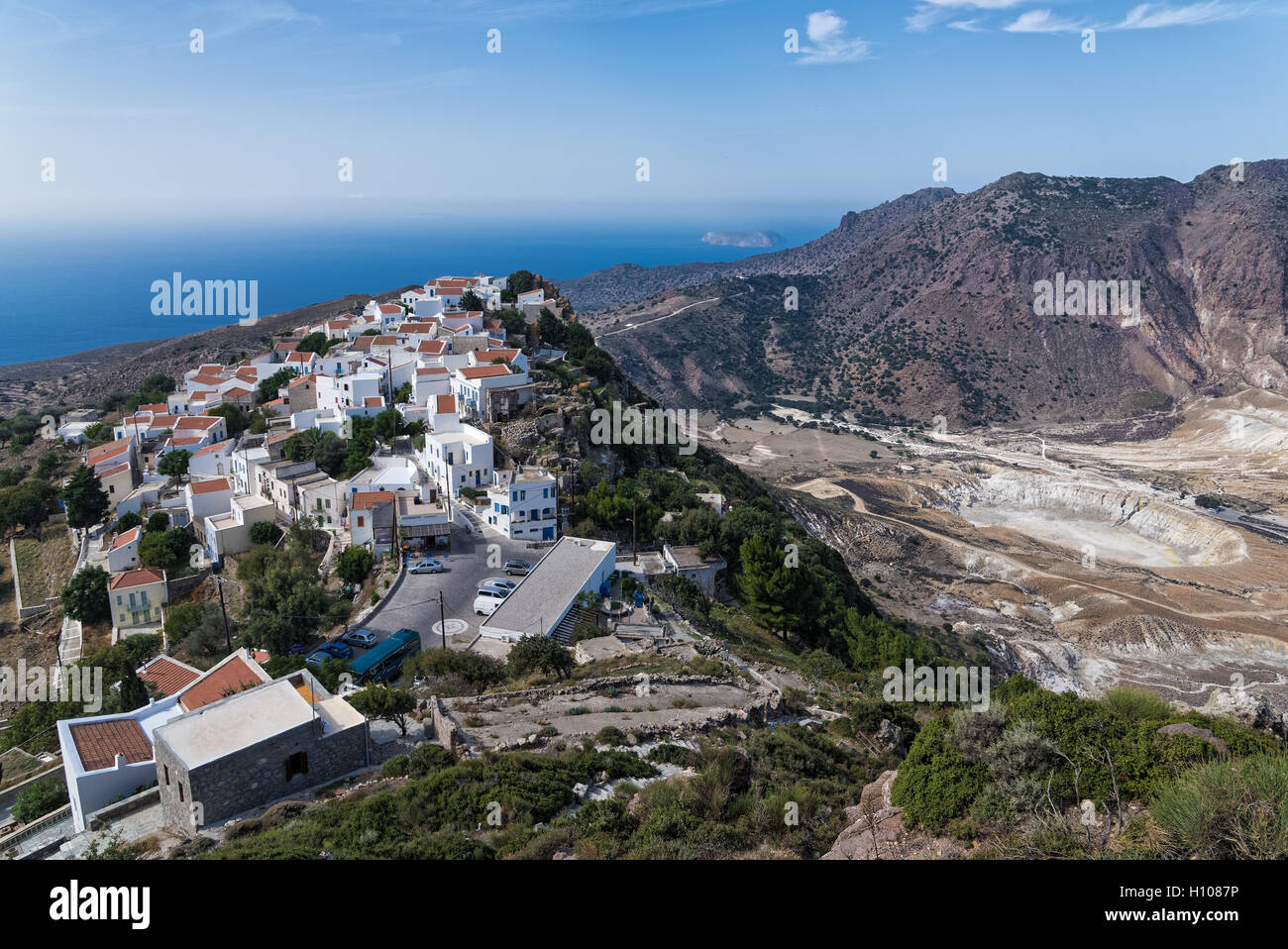 Panoramic view of the active volcano and the village of Nikia in ...