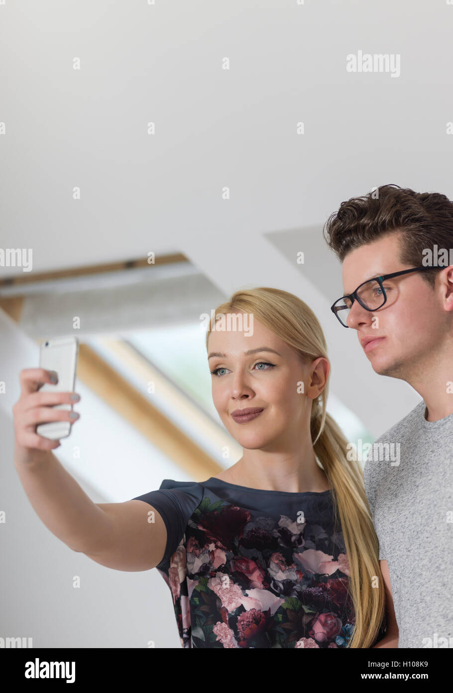 Close-up of friends using their phones and having fun together Stock ...