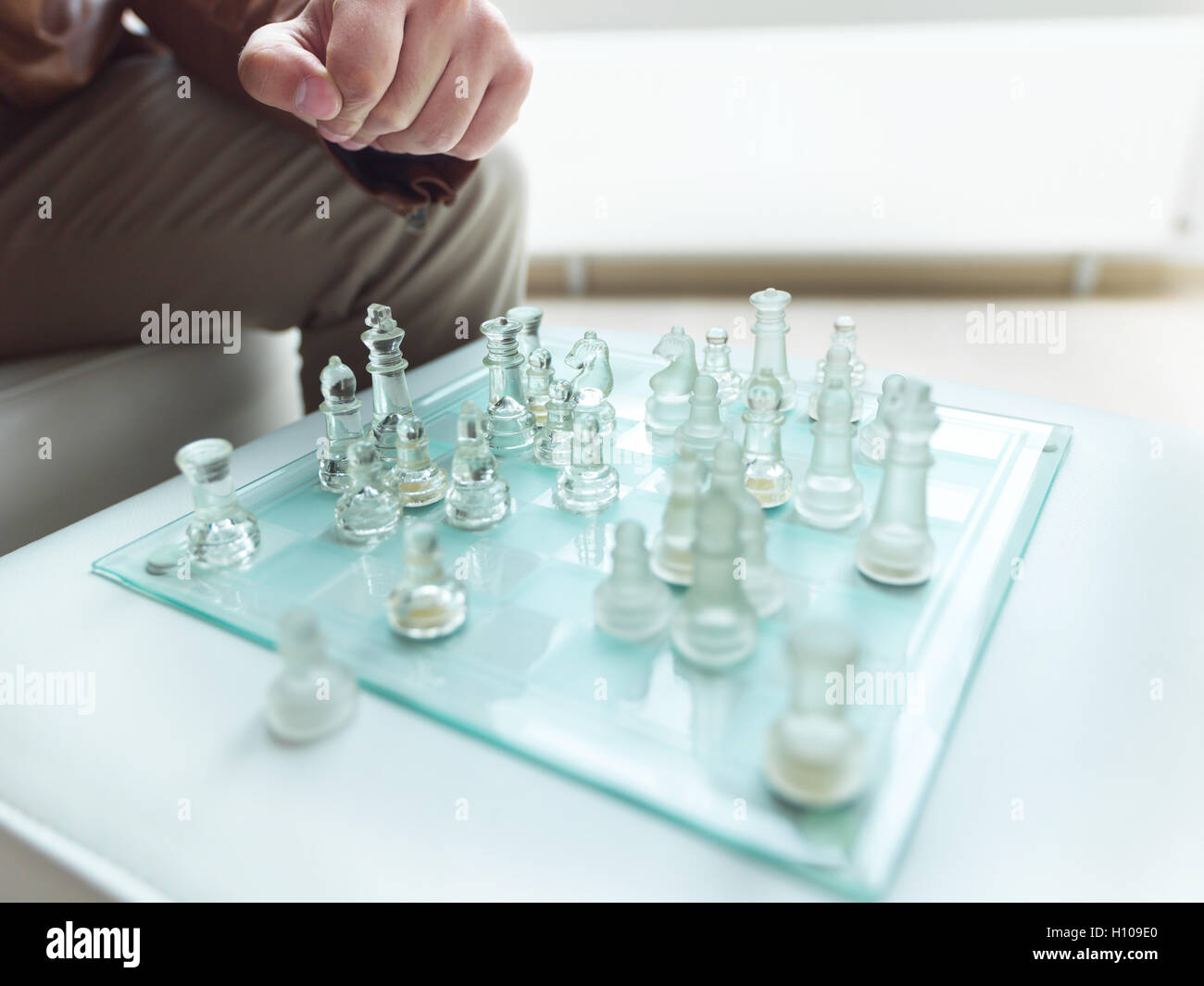A man playing chess and thinking about a suitable strategy Stock Photo ...