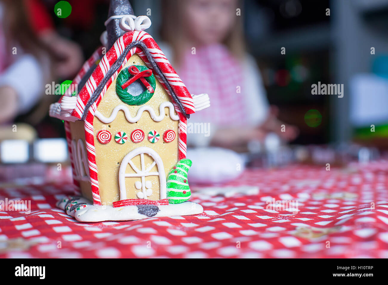 Gingerbread fairy house decorated by colorful candies on a background ...