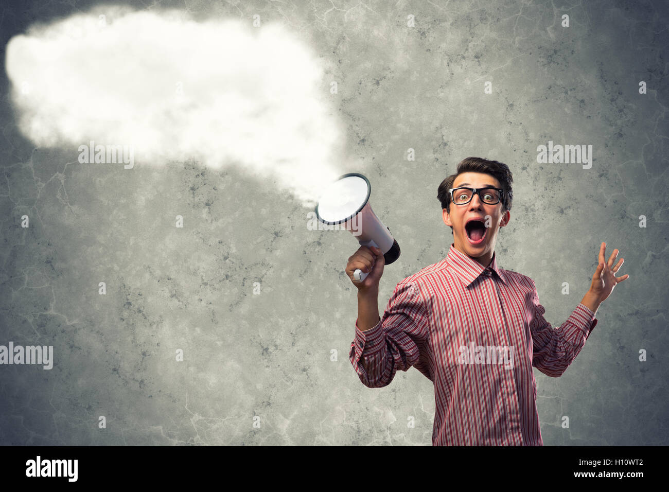 man yells into a megaphone Stock Photo - Alamy