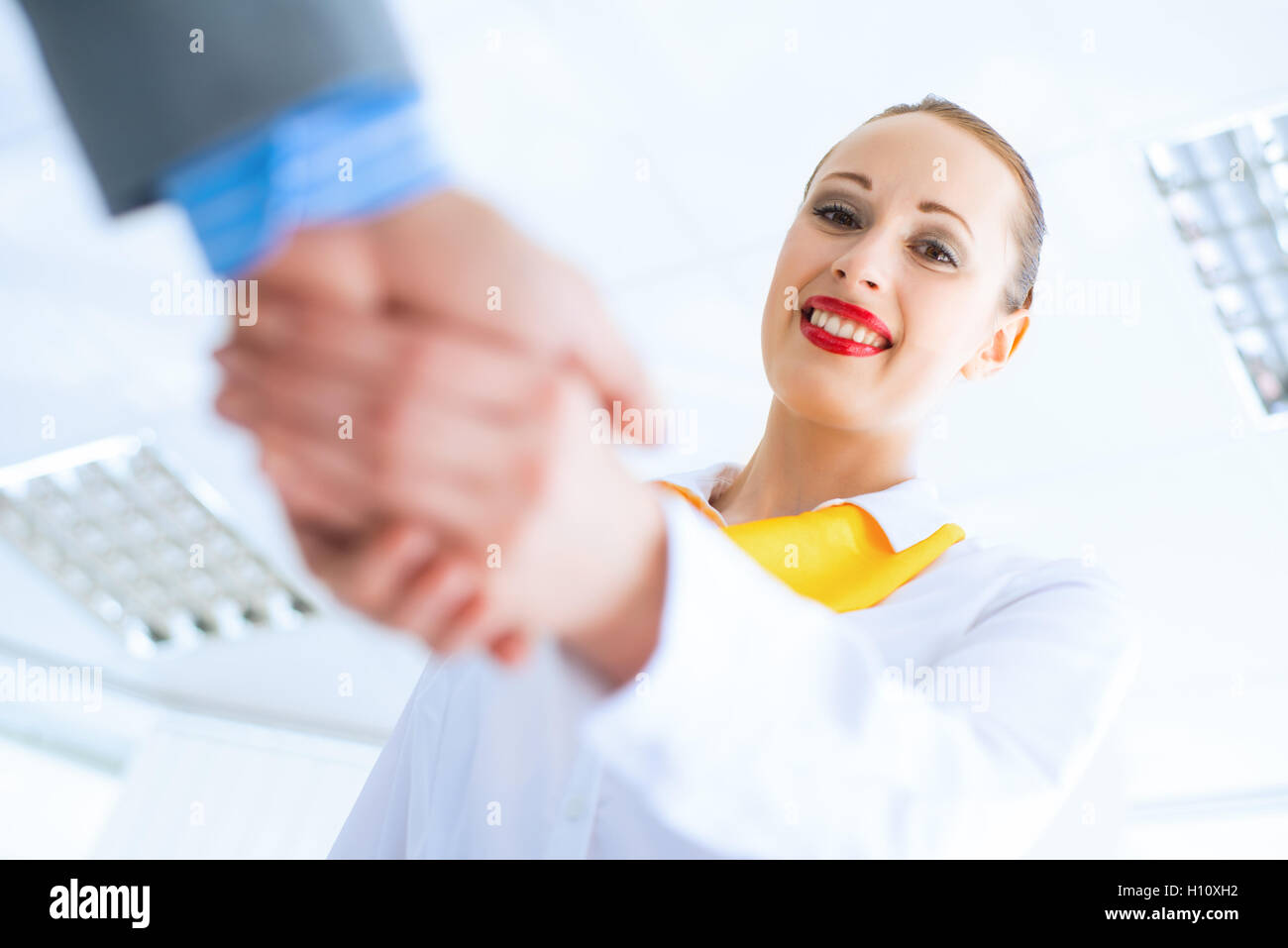 business woman shaking hands with a client Stock Photo - Alamy