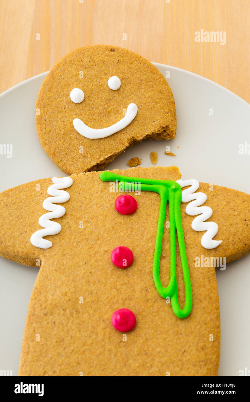 Broken Gingerbread man Stock Photo - Alamy