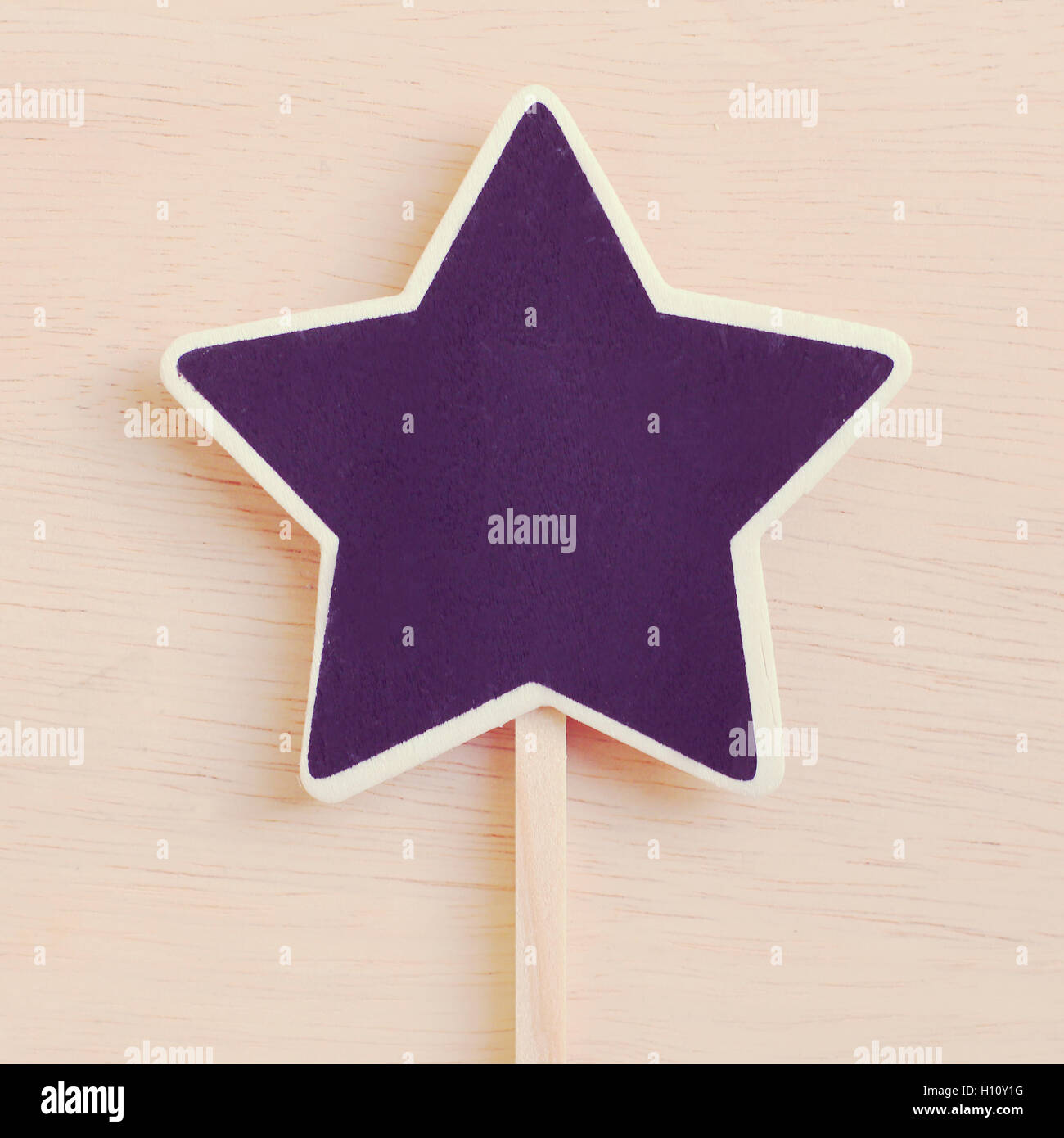 Star shape blackboard on wood with retro filter effect Stock Photo - Alamy