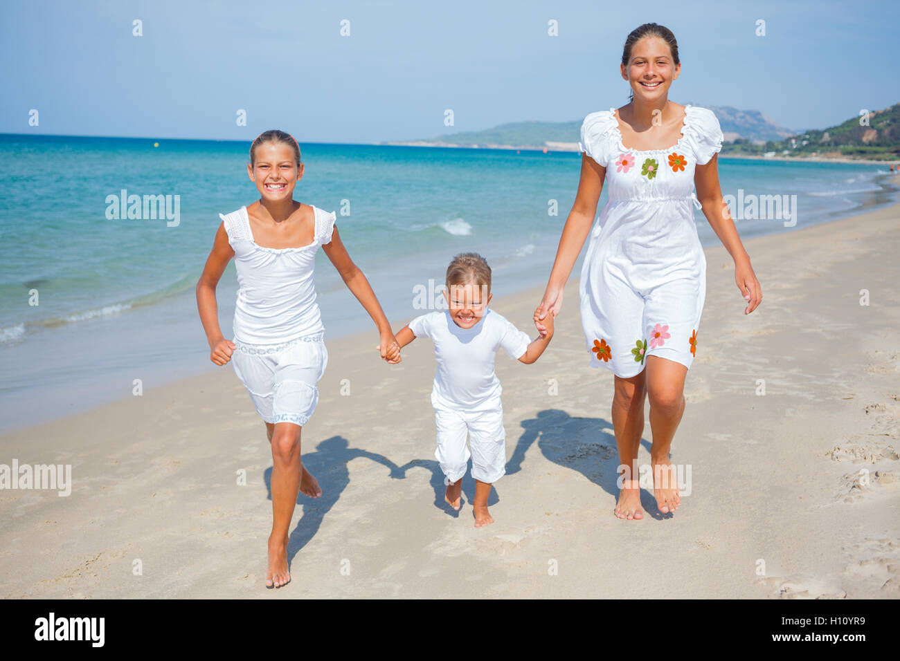 Cute kids on the beach Stock Photo - Alamy