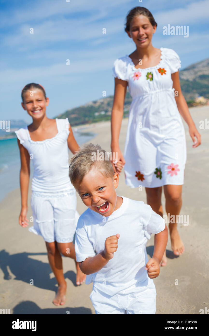 Cute kids on the beach Stock Photo - Alamy