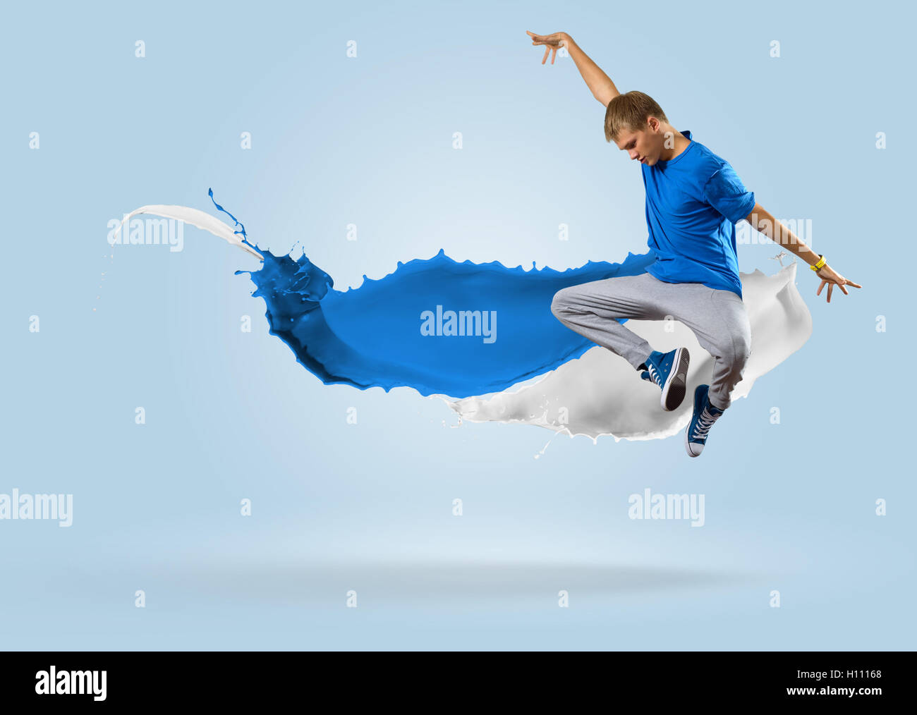 young male dancer jumping with splash of paint Stock Photo - Alamy