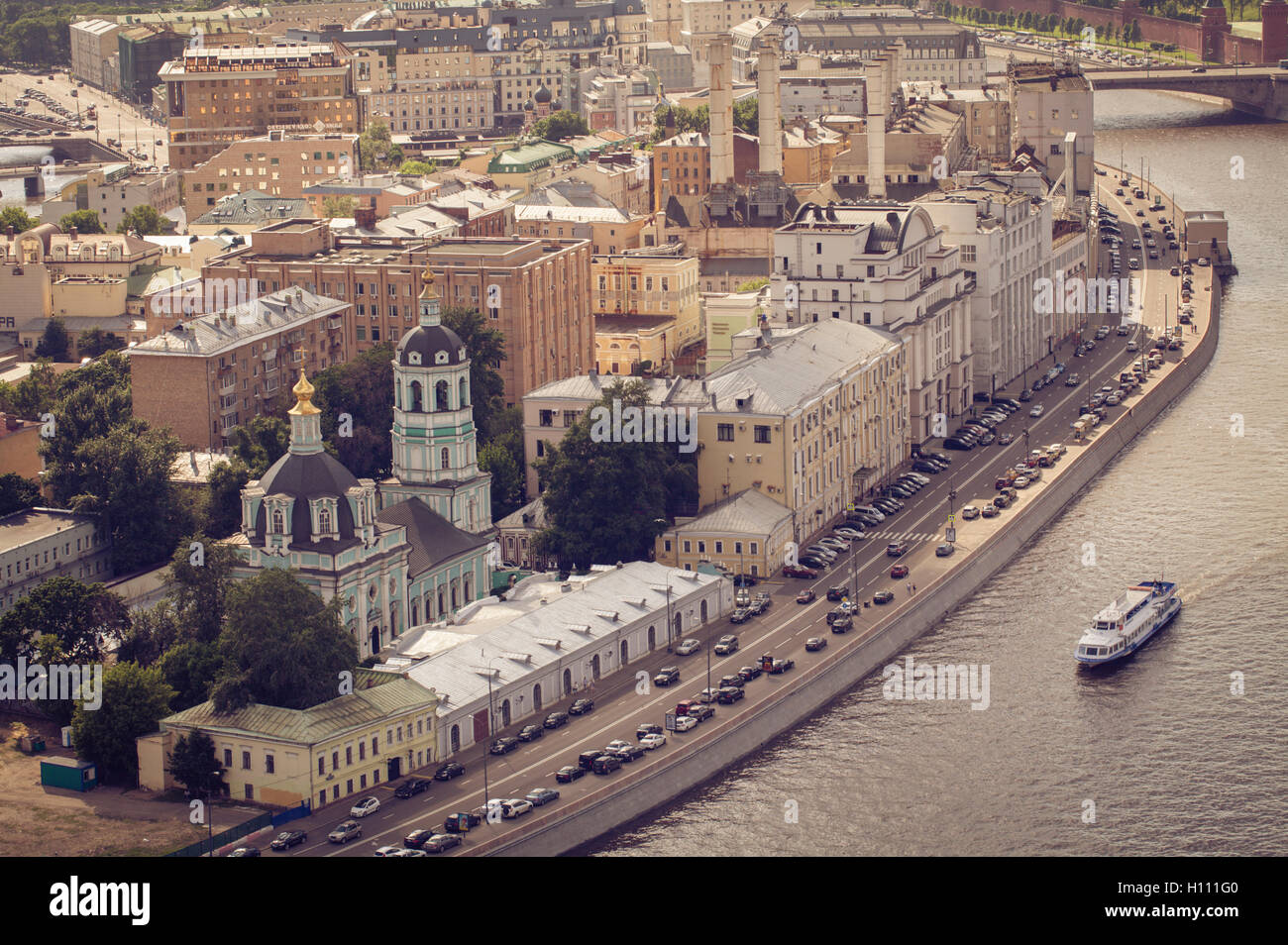 Moscow city shot from above with church river and a boat sailing in ...