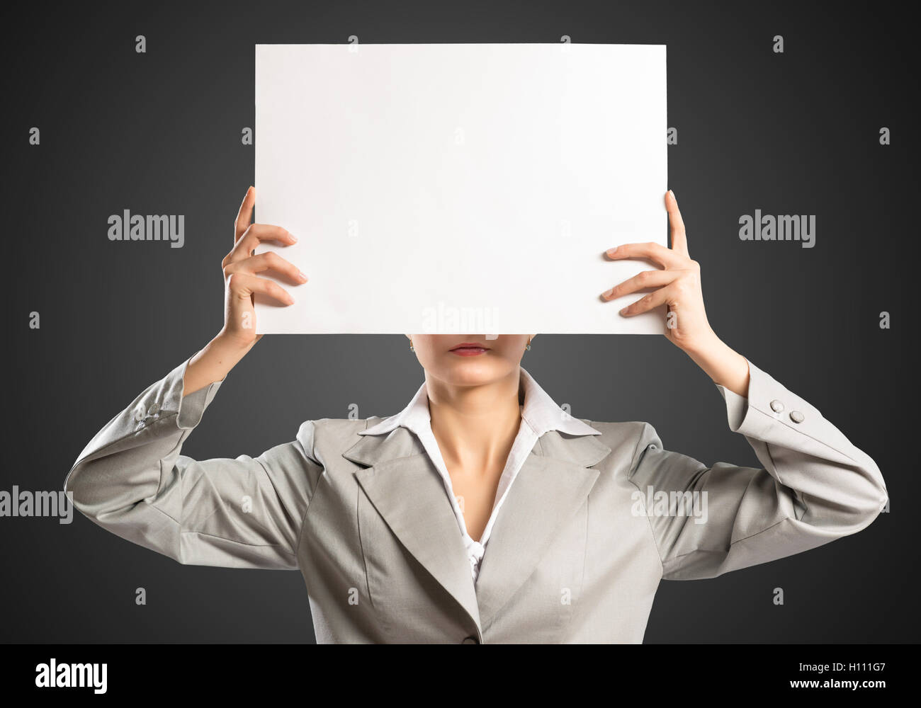 business woman holding a poster Stock Photo - Alamy