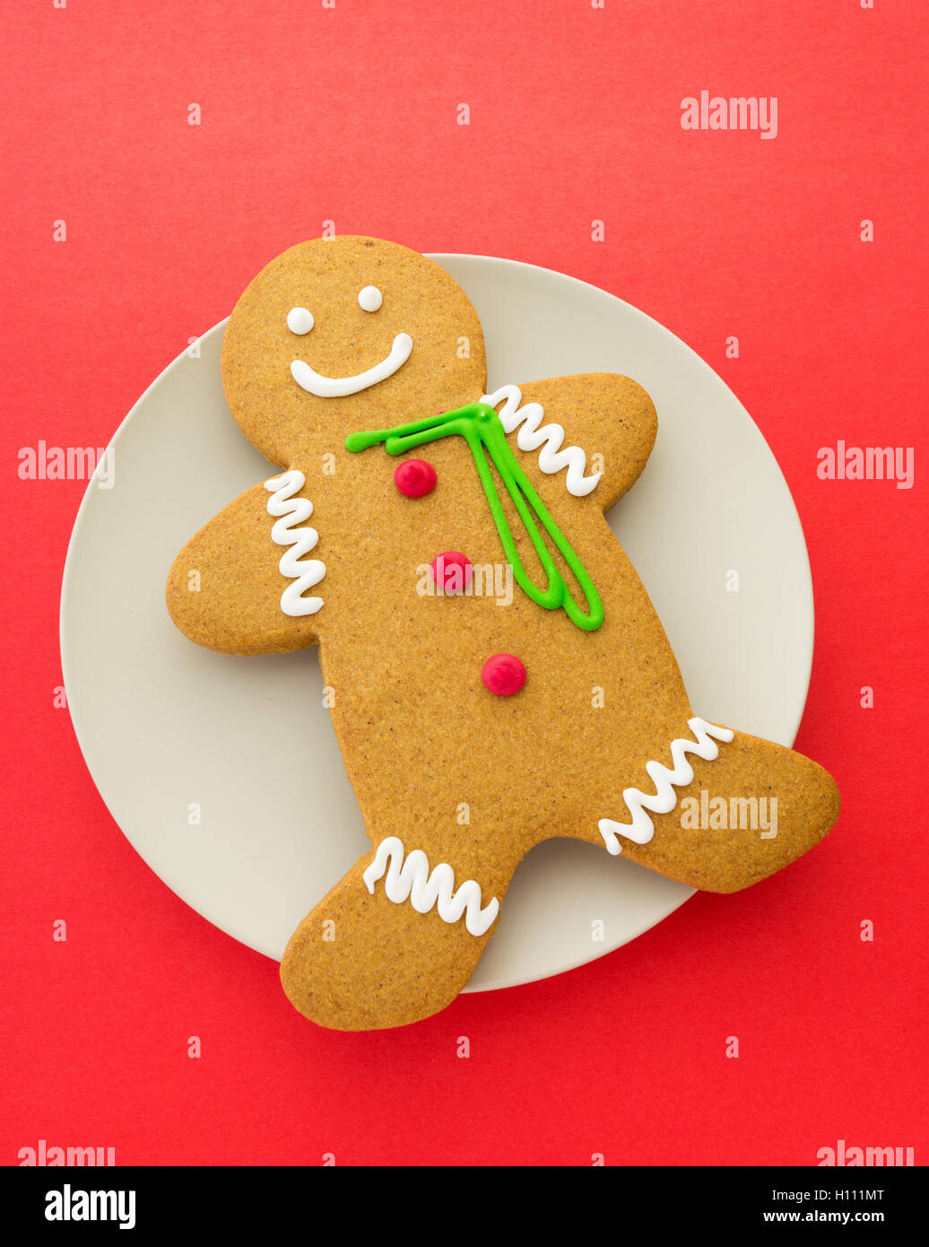 Gingerbread man on red background Stock Photo - Alamy