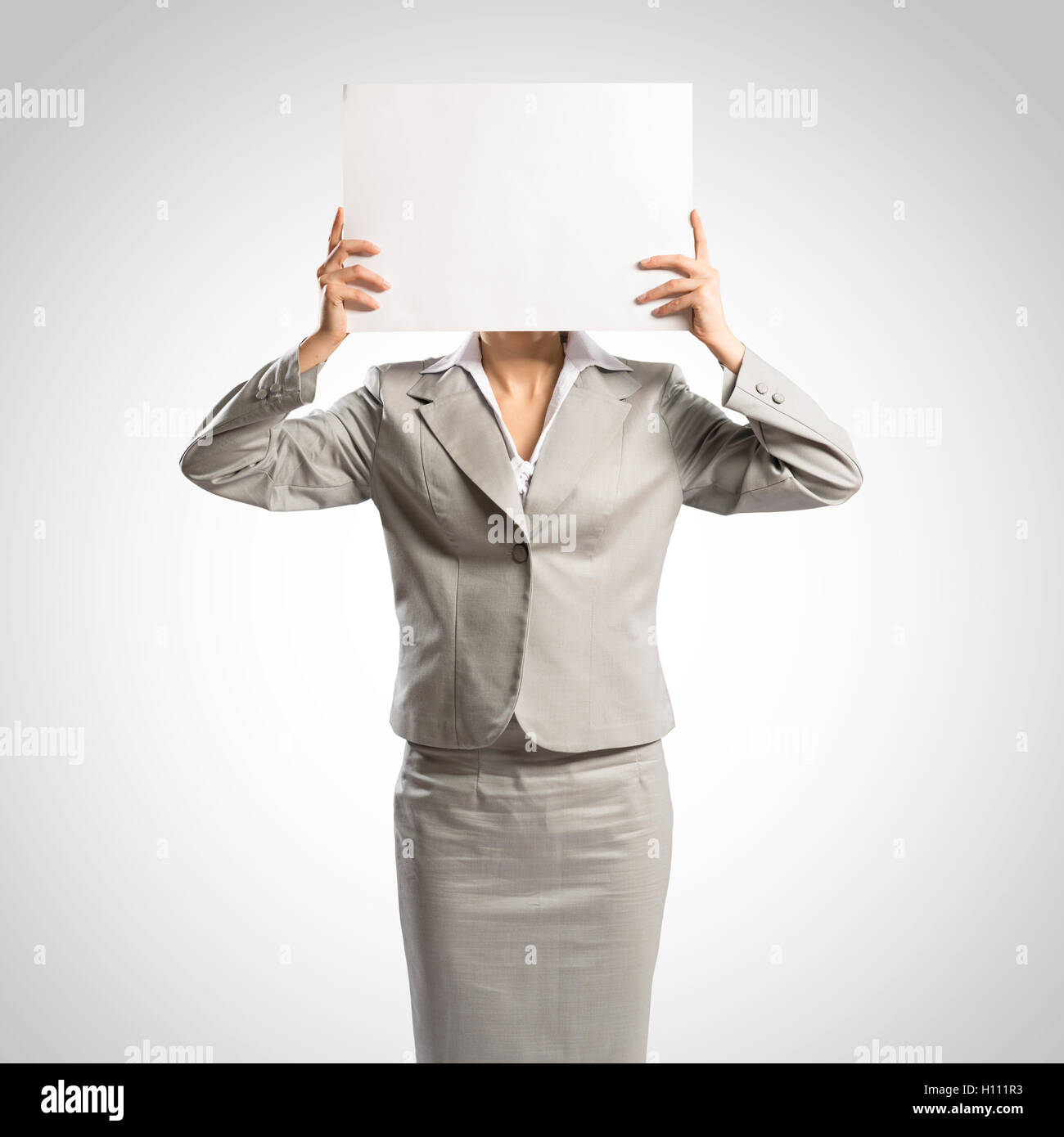 business woman holding a poster Stock Photo - Alamy