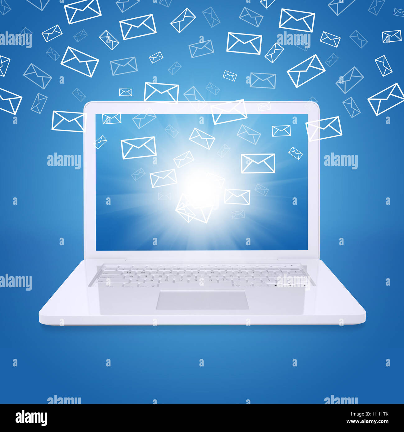 Emails fly out of laptop screen Stock Photo - Alamy