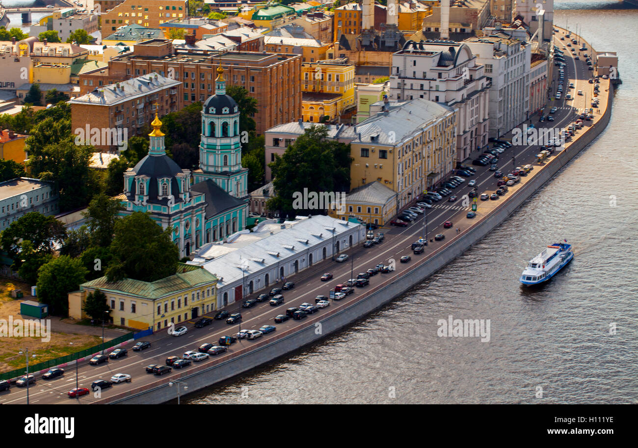 Moscow city shot from above with church river and a boat sailing in ...