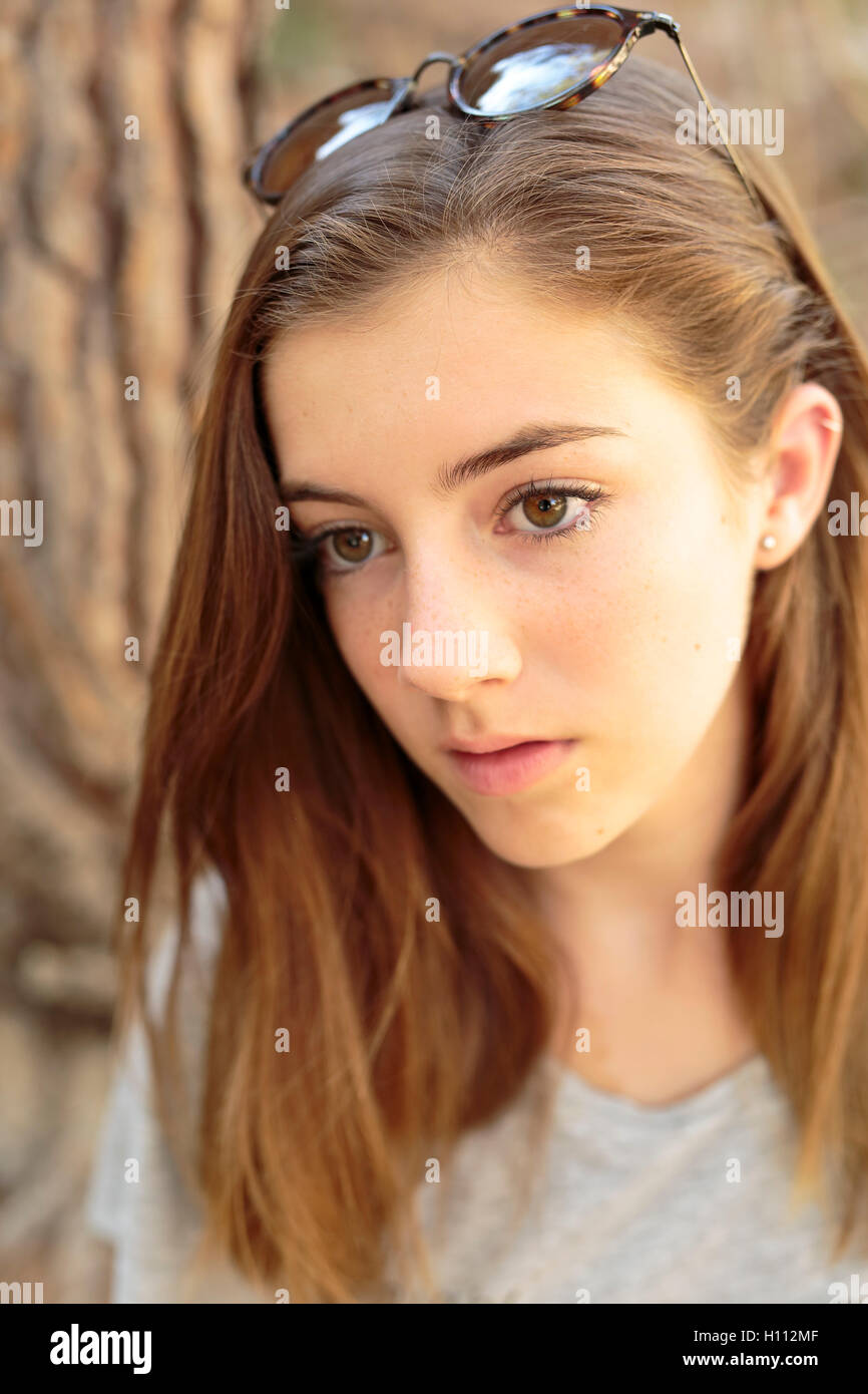 Portrait of teenage girl with natural light and background blur Stock ...