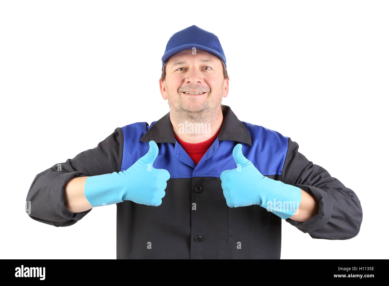Pleased and happy worker with thumbs up Stock Photo - Alamy