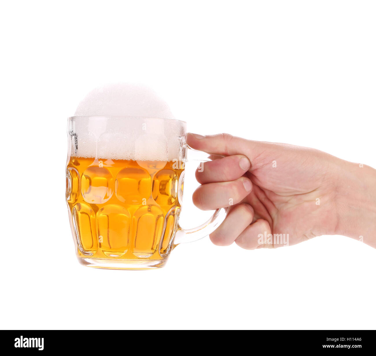 Man hand holds beer in mug Stock Photo - Alamy
