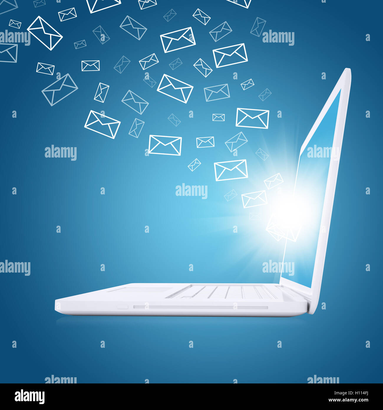 Emails fly out of laptop screen Stock Photo - Alamy