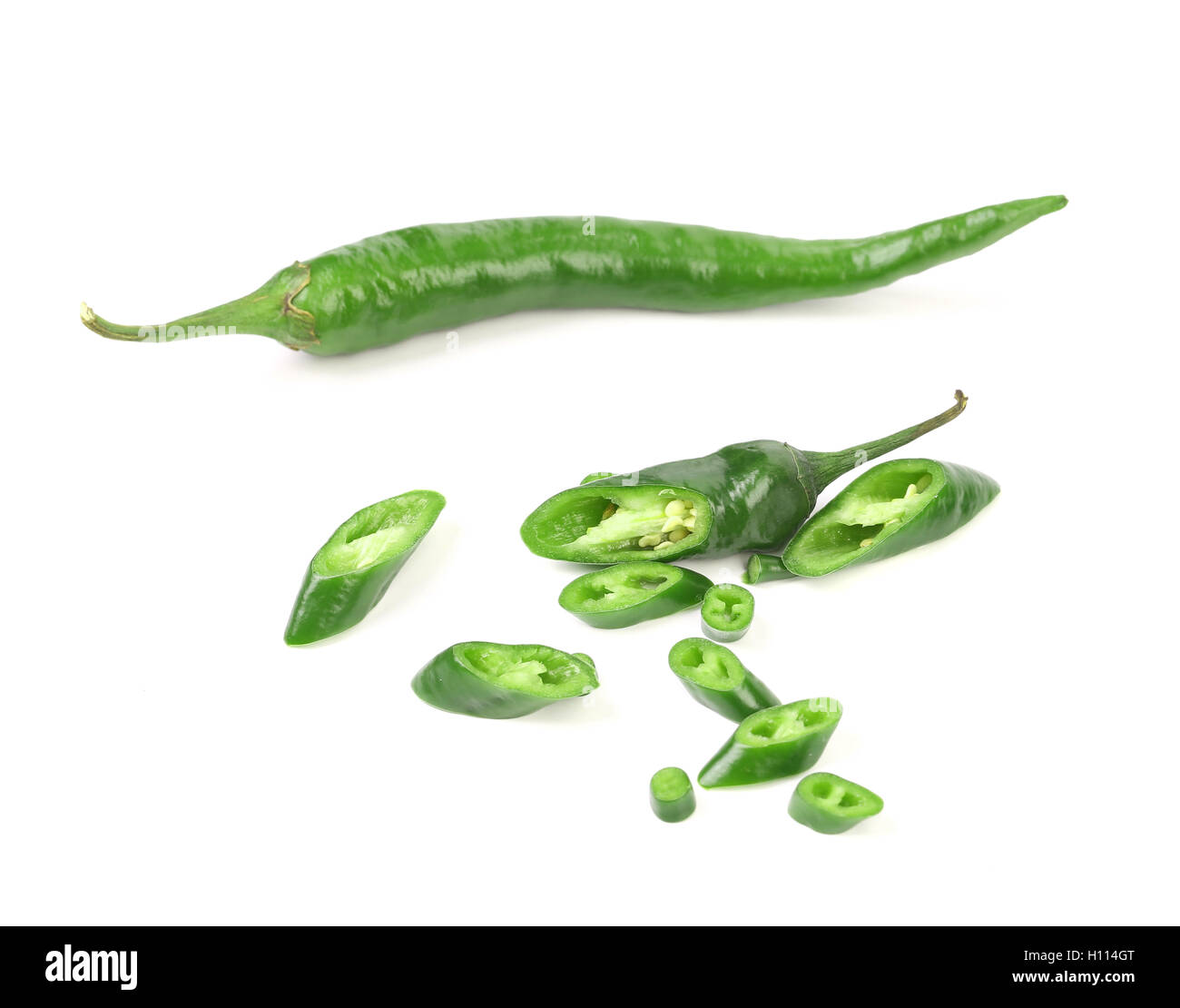 Whole and slices of green pepper Stock Photo - Alamy