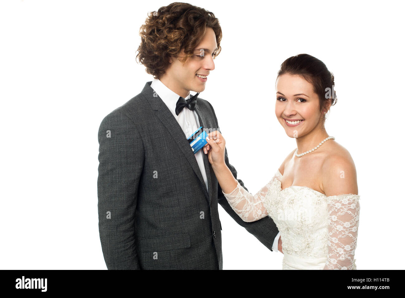 Pretty bride holding debit card Stock Photo - Alamy