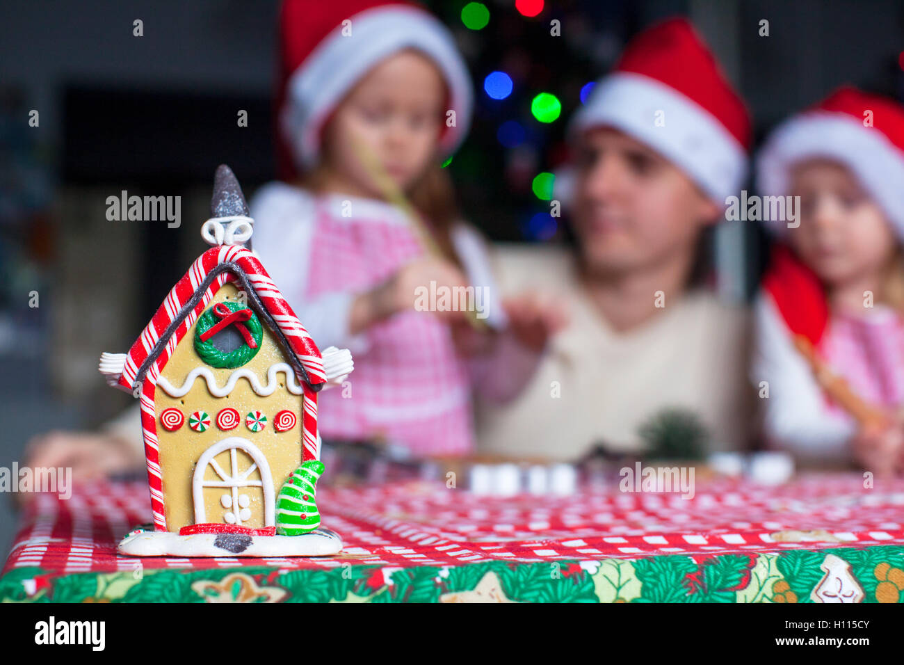 Gingerbread fairy house decorated by colorful candies on a background ...